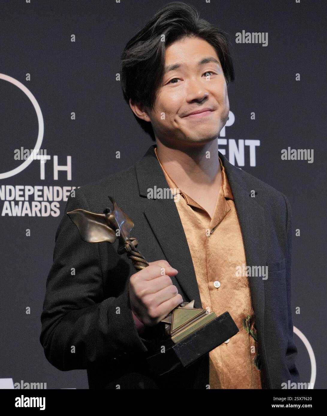 Sean Wang, winner of the Best First Screenplay award for "Dìdi" pose in ...