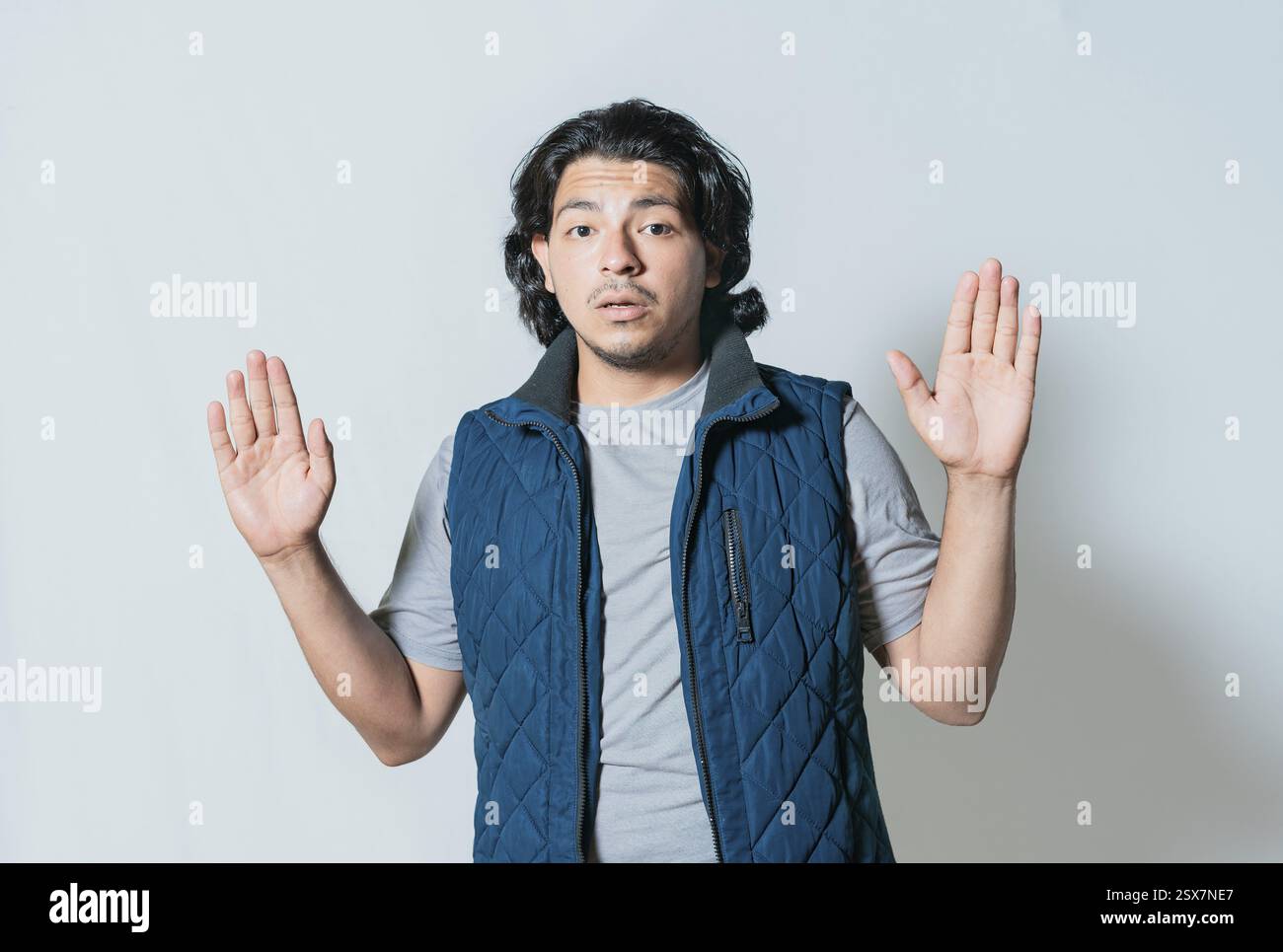 Person with scared face with raised hands. Scared man with raised hands ...