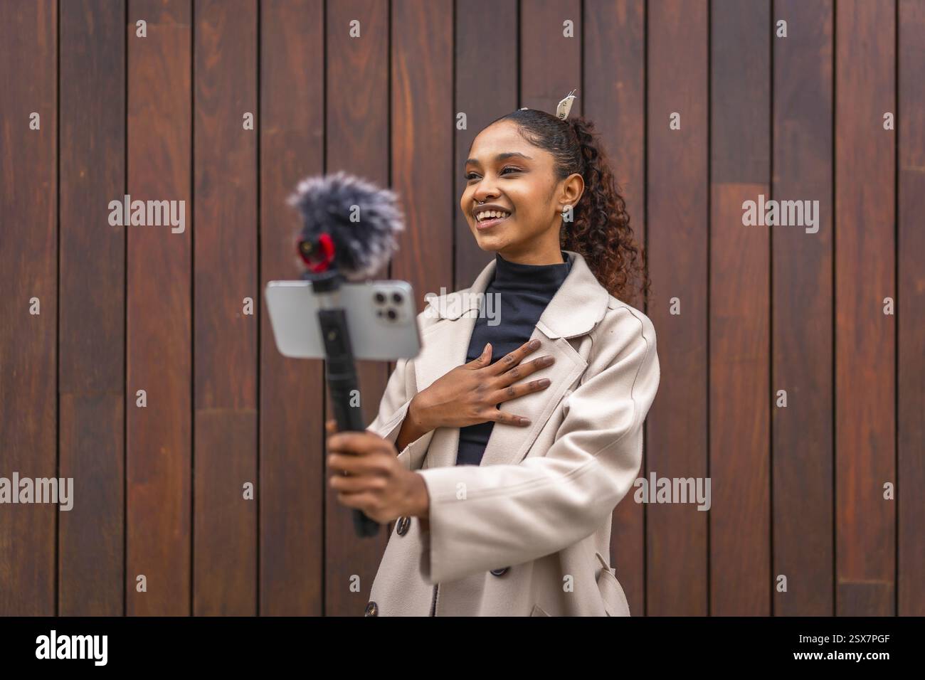 African american beauty woman vlogger smiling recording a new video ...