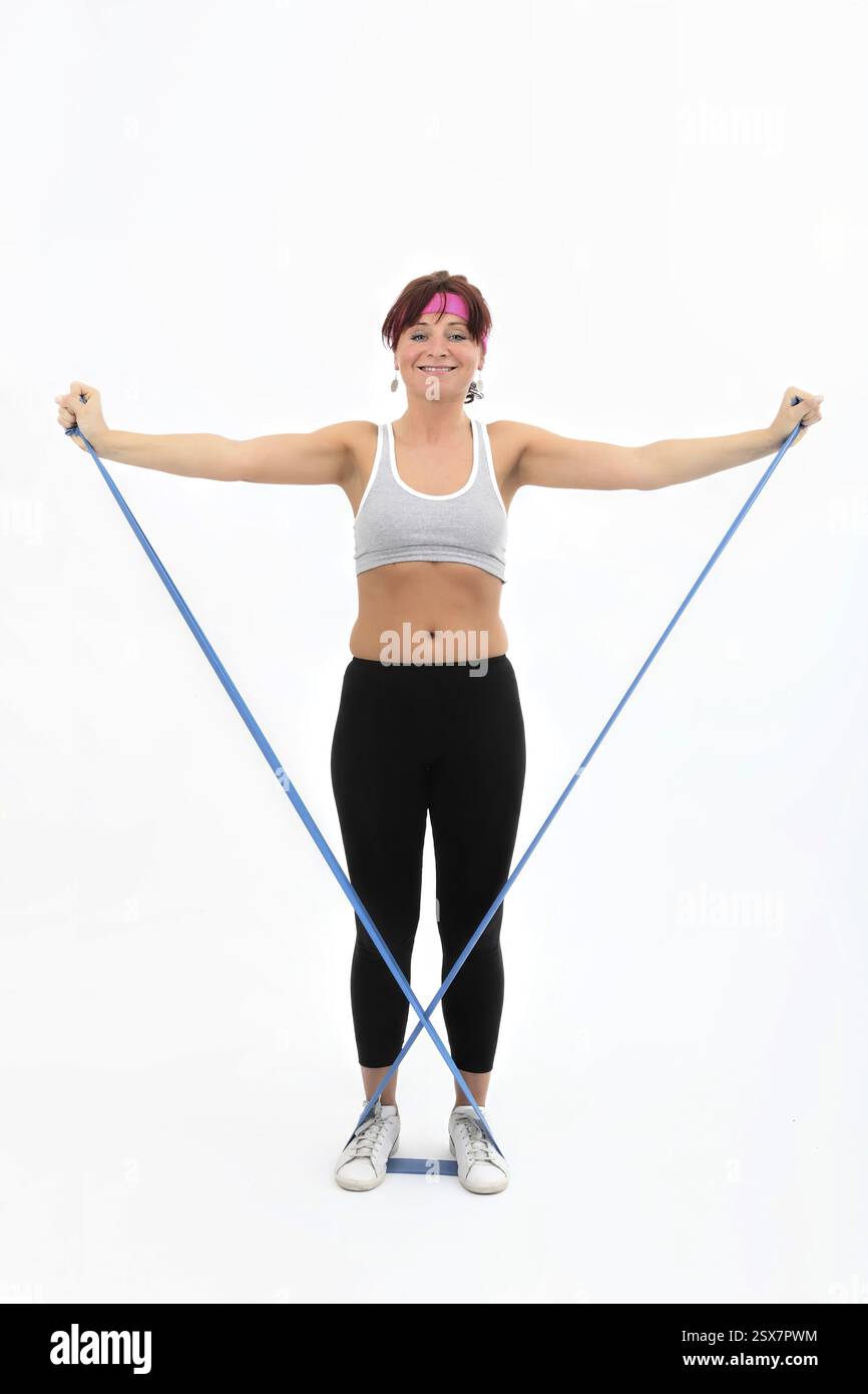 Gymnastics and floor exercises with the elastic band Stock Photo - Alamy