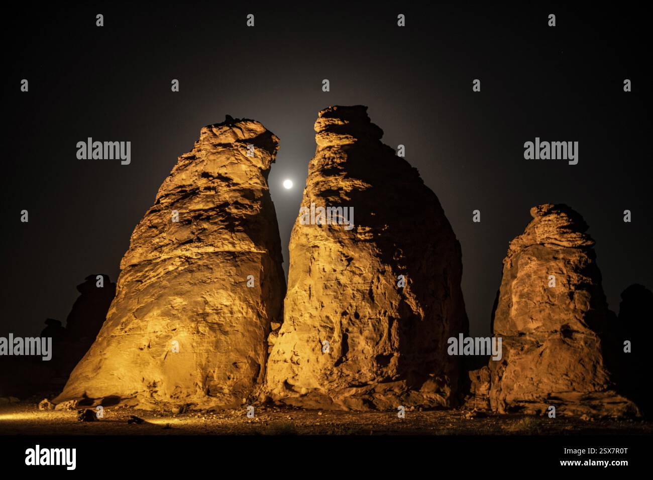Full moon behind the columnar rocks of Gharameel, Hail region, Al Ula ...