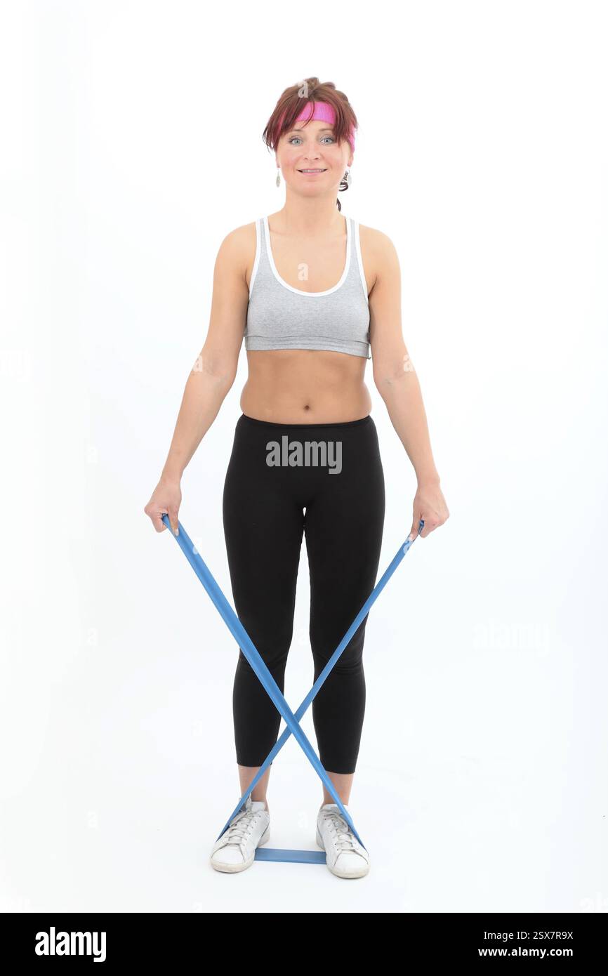 Gymnastics and floor exercises with the elastic band Stock Photo - Alamy