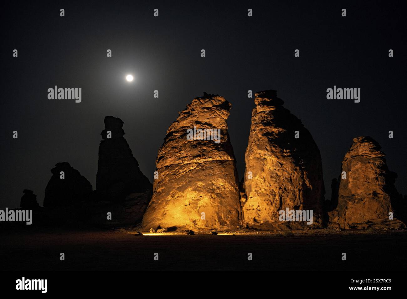 Full moon behind the columnar rocks of Gharameel, Hail region, Al Ula ...