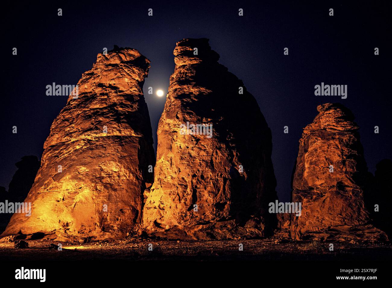 Full moon behind the columnar rocks of Gharameel, Hail region, Al Ula ...