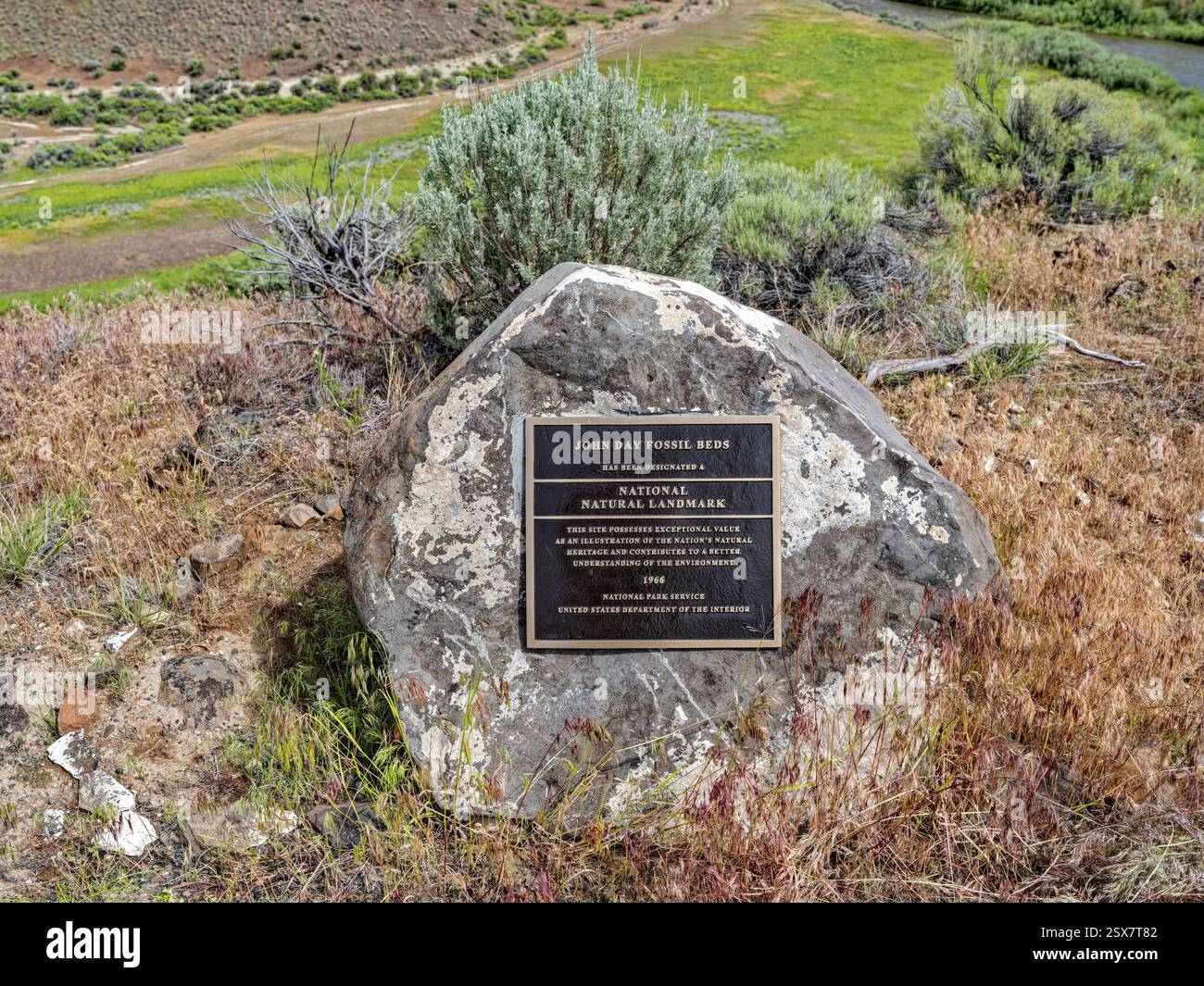 A commemorative plaque on a rock at the Sheep Creek Unit of the John ...