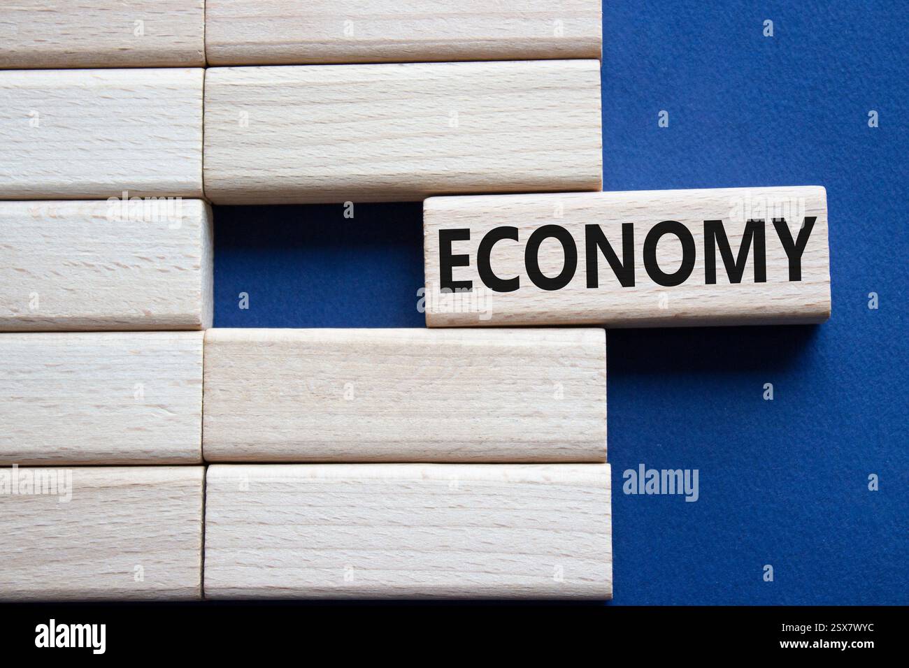 Economy symbol. Concept word Economy on wooden blocks. Beautiful deep ...