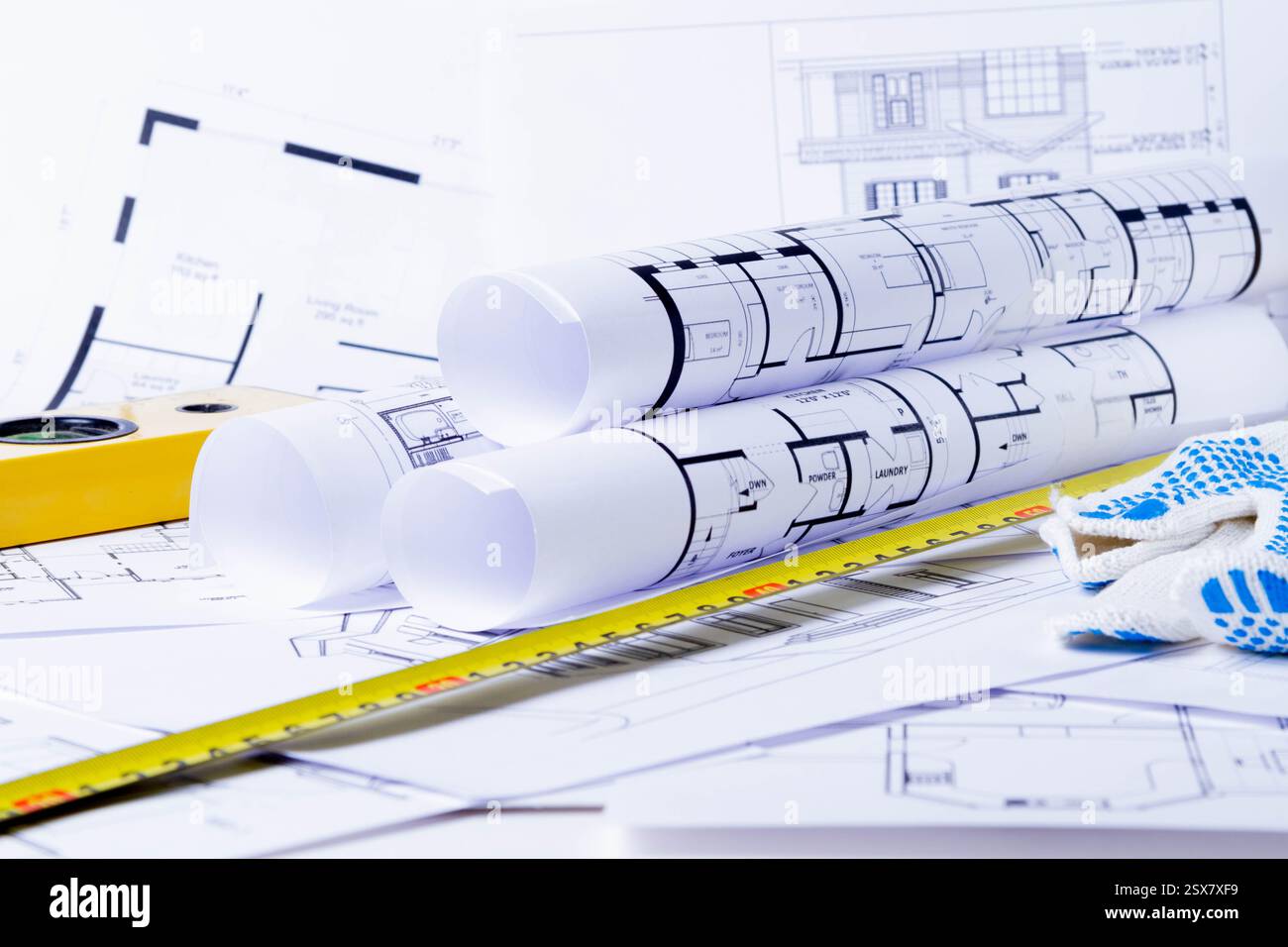 Builder's tools on the scheme of the house. Preparing to build a house ...