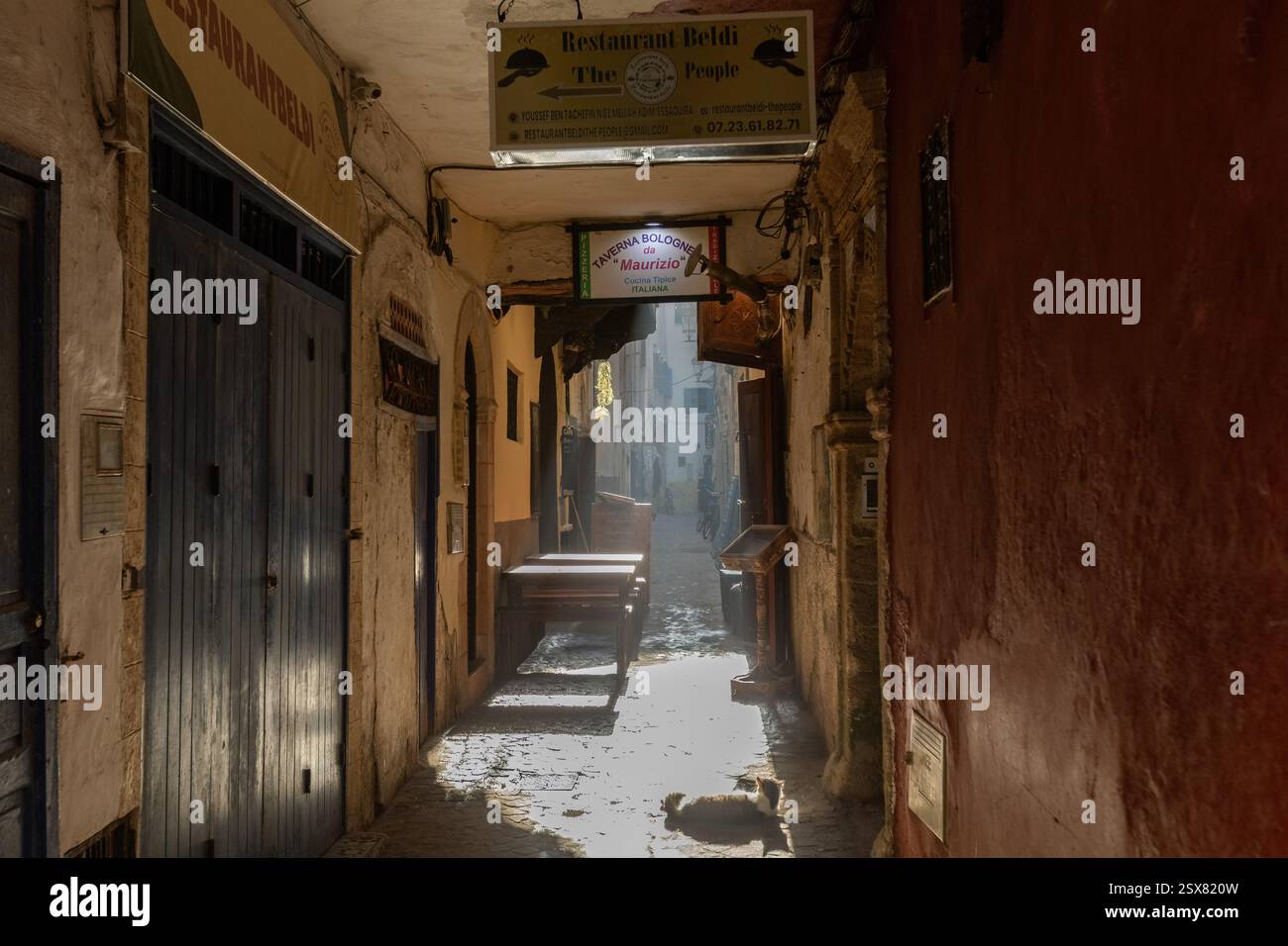 Narrow arch street in old town Medina in Essaouira Morocco Stock Photo ...