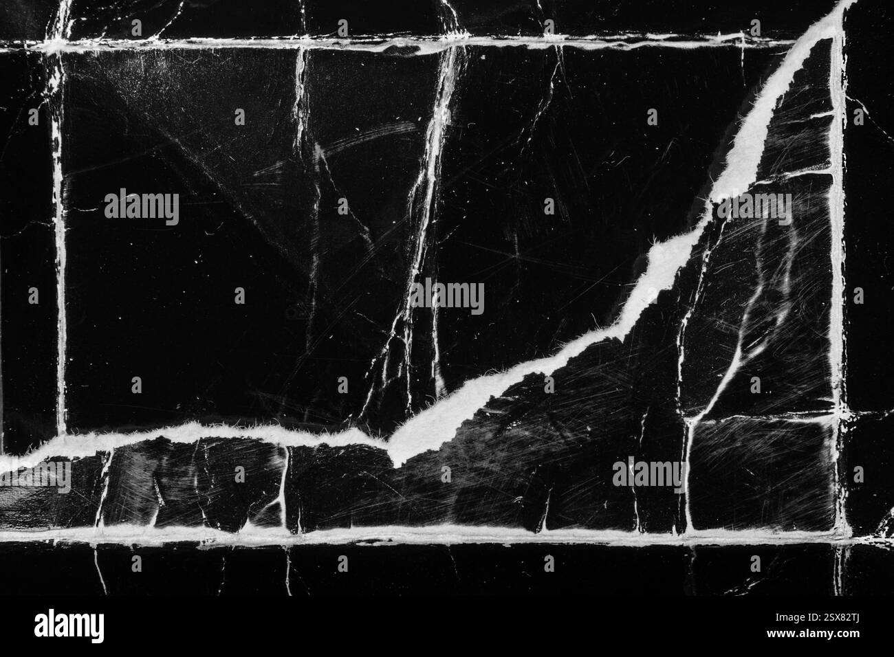Abstract black and white rectangular frame made of torn old paper ...