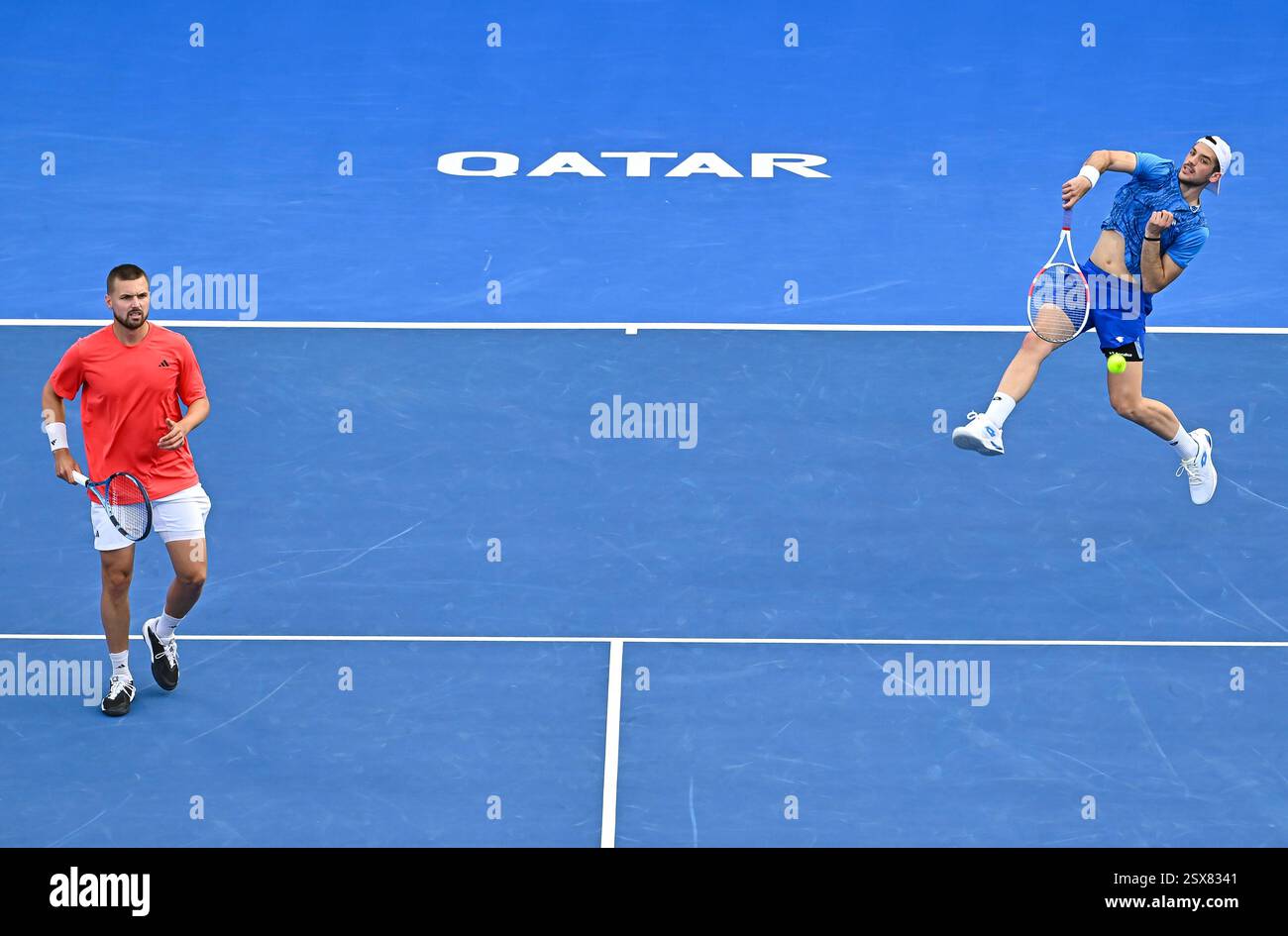 Doha, Qatar. 22nd Feb, 2025. Julian Cash (R)/Lloyd Glasspool of Britain ...