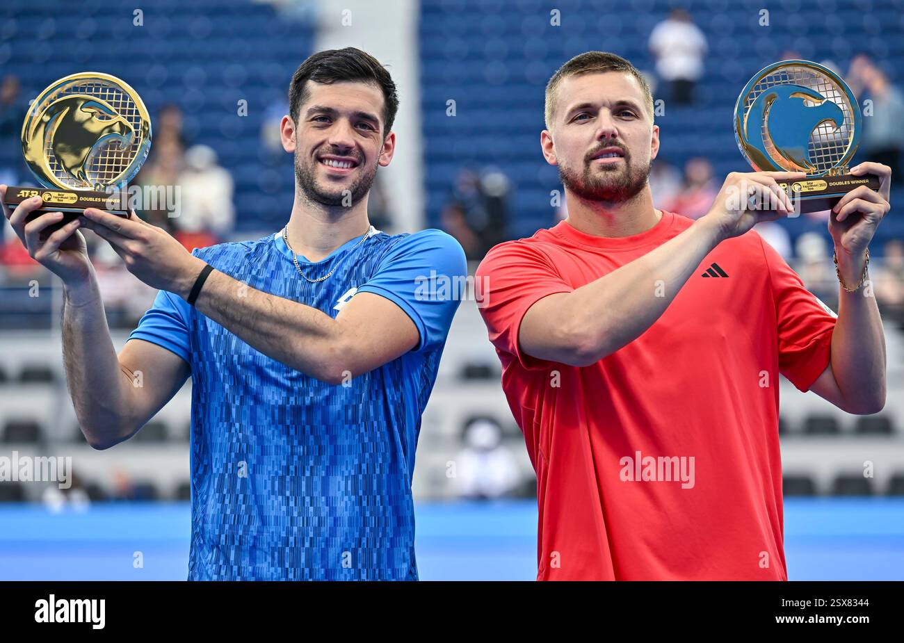 Doha, Qatar. 22nd Feb, 2025. Winners Julian Cash (L)/Lloyd Glasspool of ...