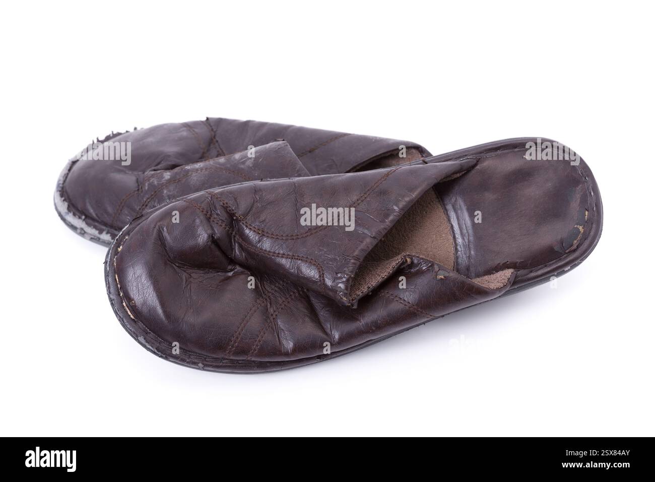 Old worn leather slippers isolated on white background Stock Photo - Alamy