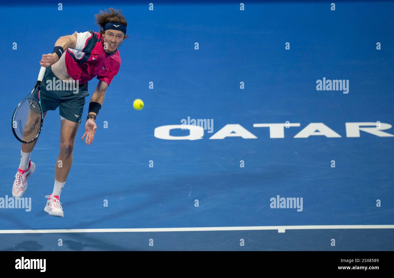 Doha, Qatar. 22nd Feb, 2025. Andrey Rublev serves during the men's singles final match between ...