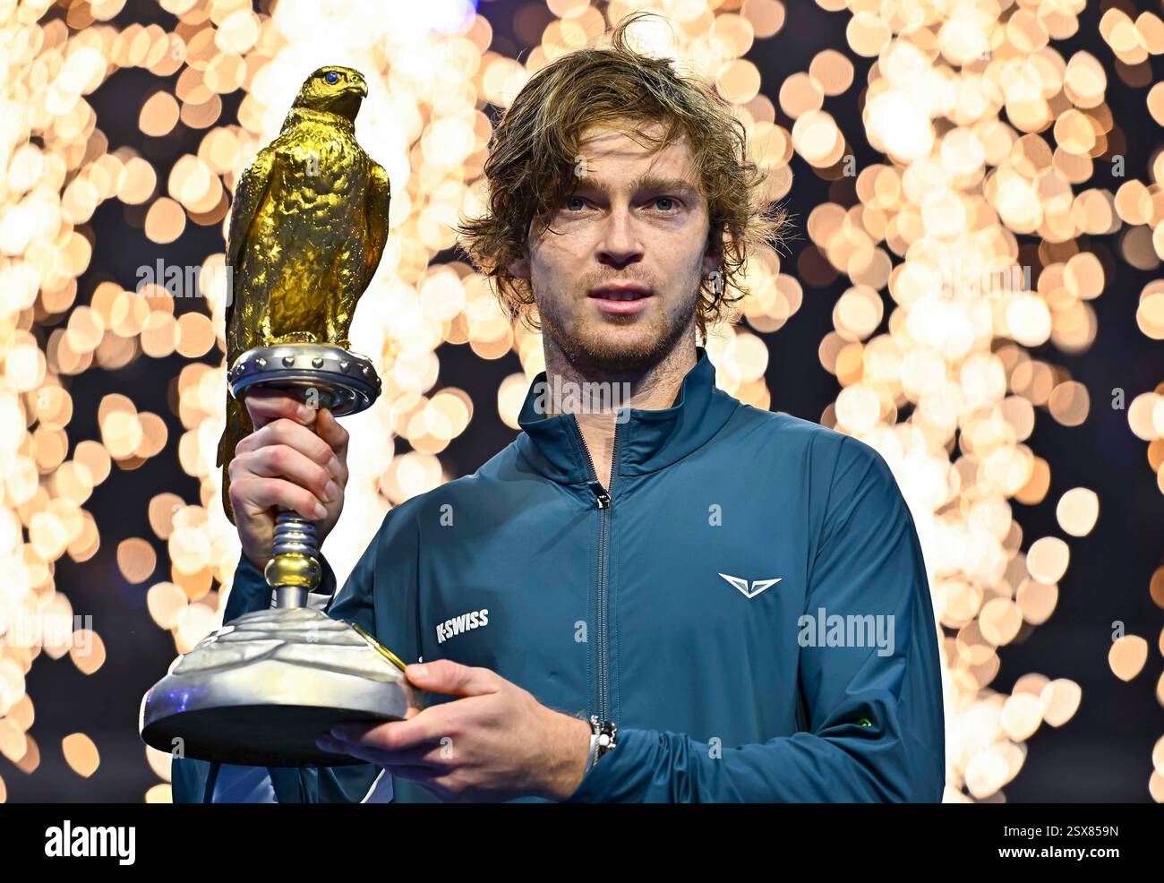 Doha, Qatar. 22nd Feb, 2025. Andrey Rublev poses with the trophy during the awarding ceremony ...
