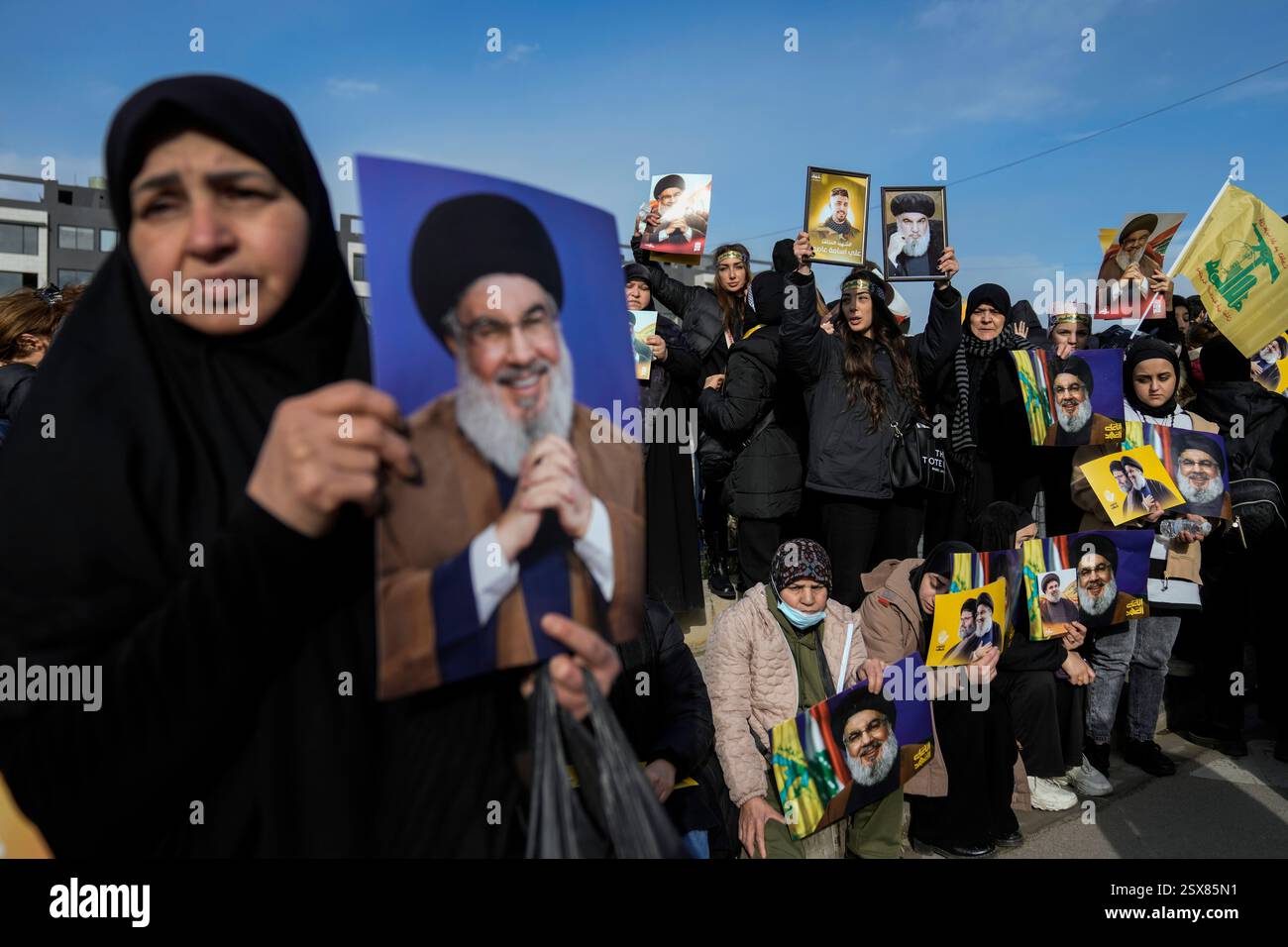 Mourners hold pictures of Lebanon's former Hezbollah leaders, Hassan ...