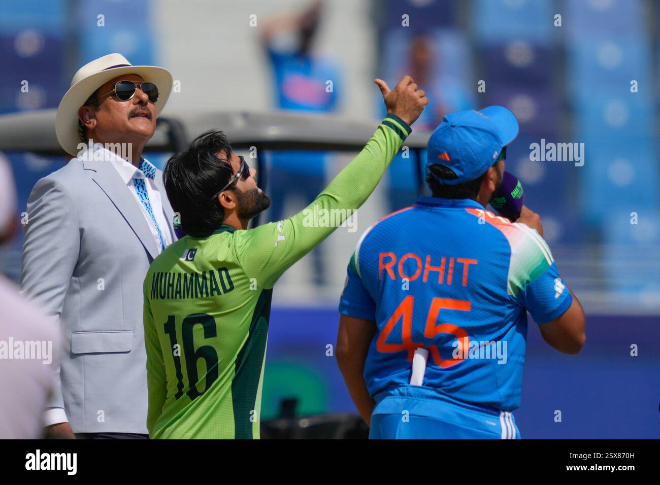 Pakistan's captain Mohammad Rizwan, centre, tosses the coin, as India's ...