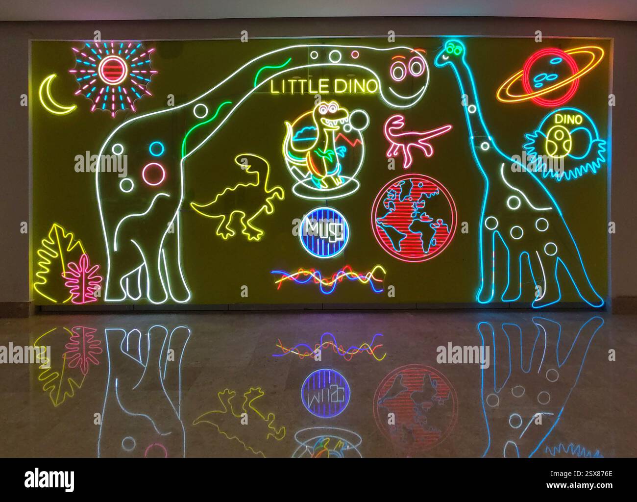 Illuminated neon dinosaur wall display Stock Photo - Alamy