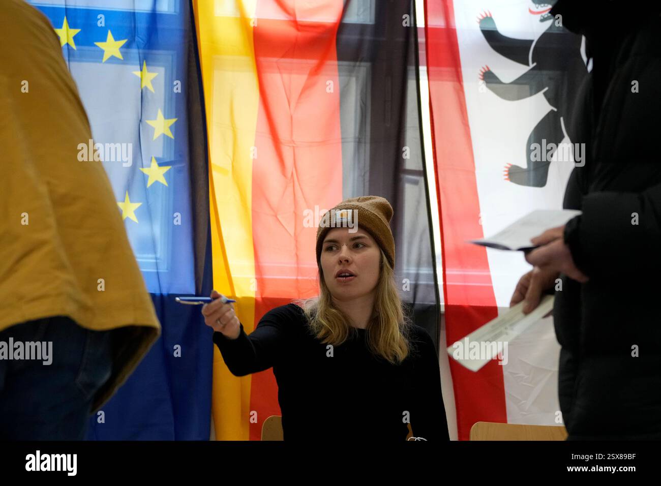 Residents arrive to cast a vote at a polling station in Berlin, Germany ...