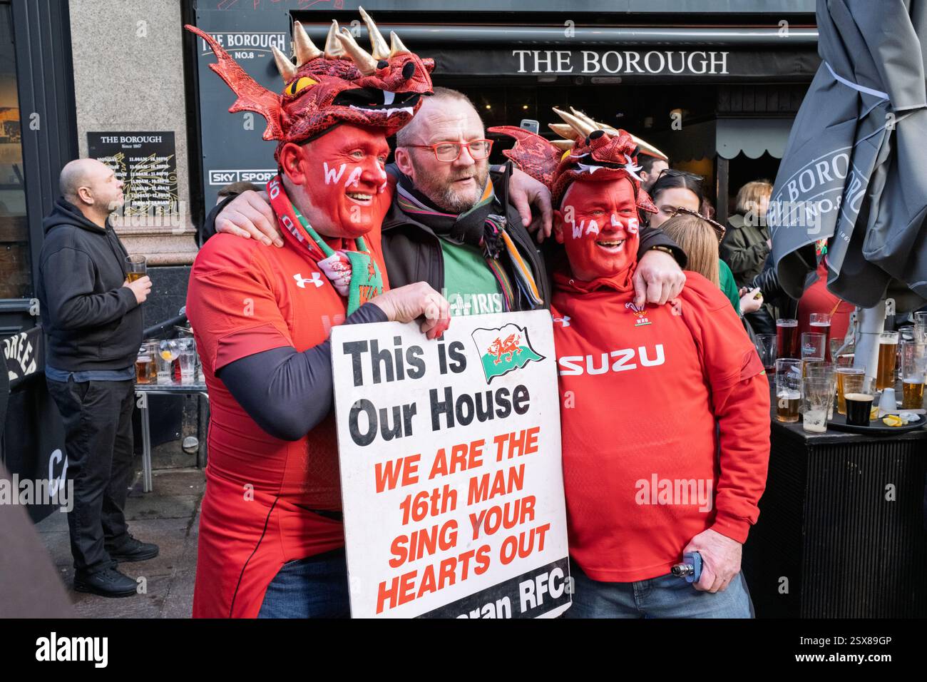 Rugby fans posing for a photo in Cardiff city centre, Six Nations match ...
