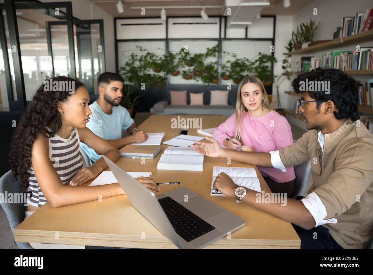 Group of students researching, studying together met in library Stock ...