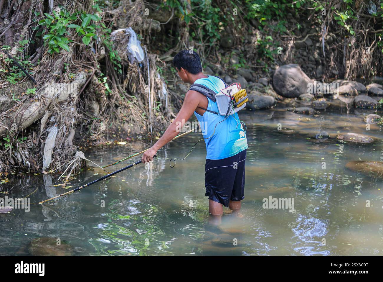 Pampanga, Philippines. Feb 23,2025. A Filipino man practices electric ...