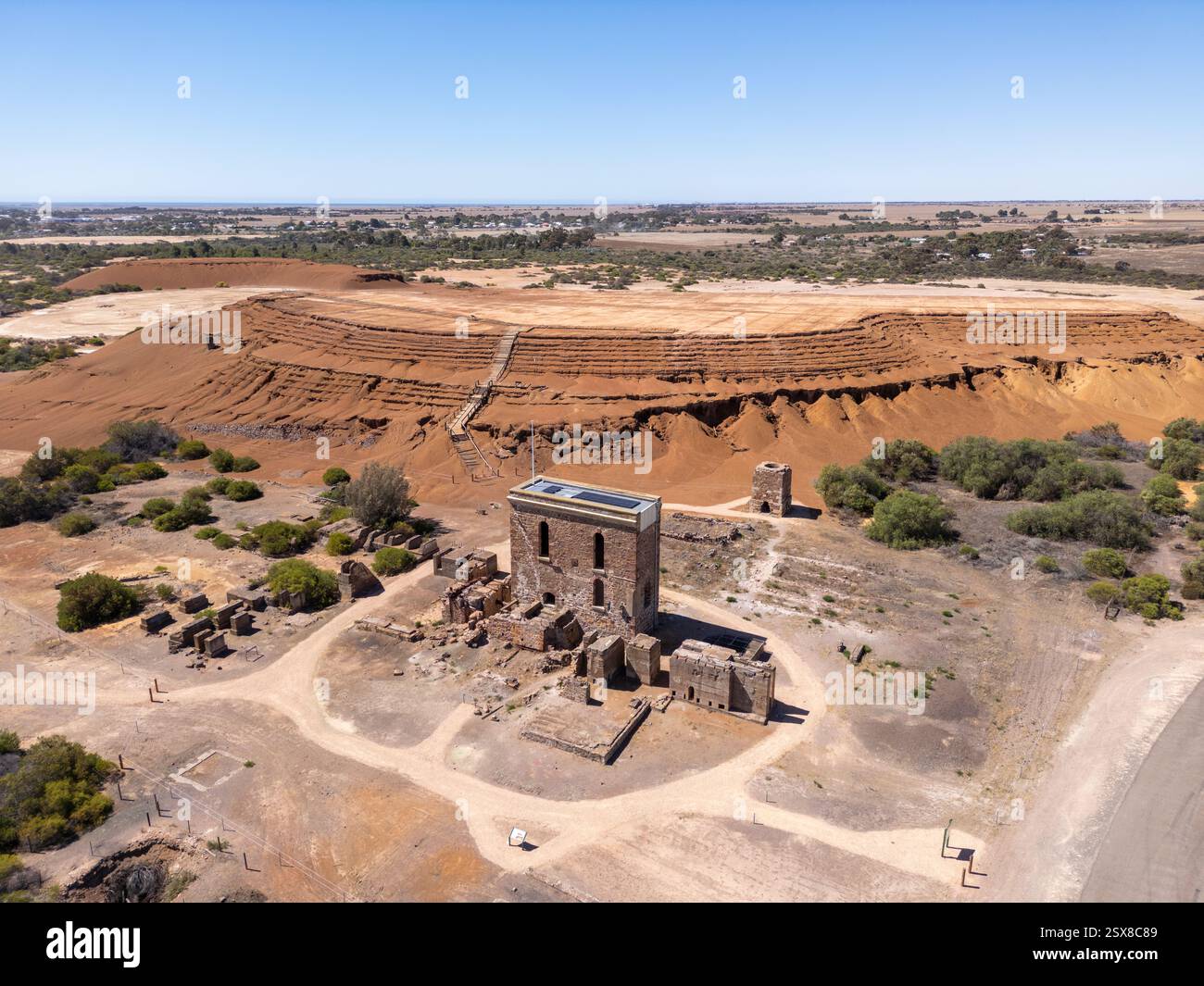 Building used to treat copper ore from local mines with tailings dam ...