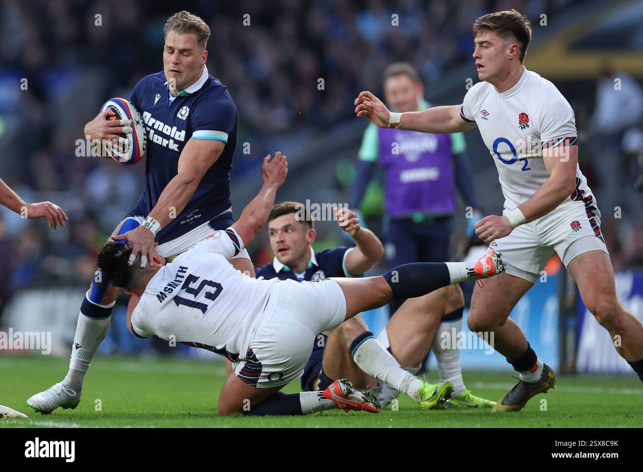 Scotland's Duhan van der Merwe, left, holds off England's Marcus Smith ...