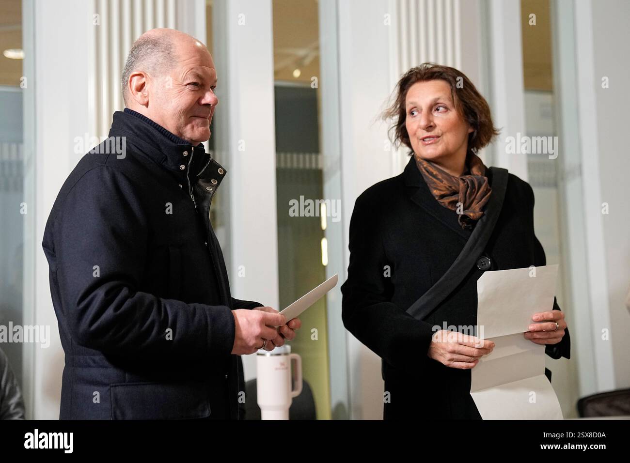 German Chancellor Olaf Scholz arrives with his wife Britta Ernst to ...