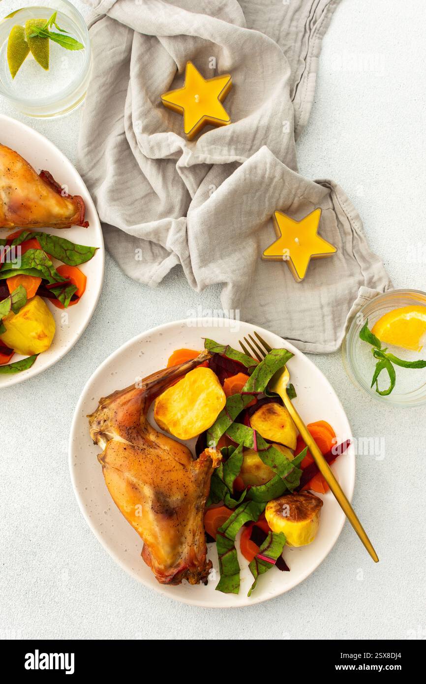 Enjoy a delicious, hearty meal with baked rabbit, roasted potatoes, and ...