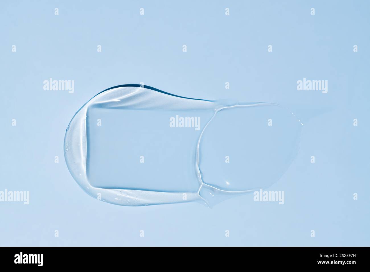 Aloe vera soothing gel smear texture on blue background. Skin care ...