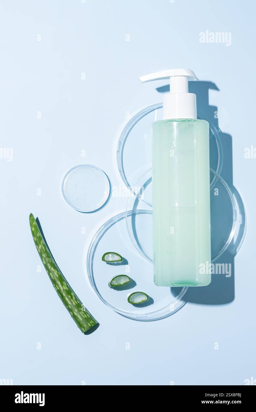 Petri dish with Aloe vera gel and soap and unlabeled pump bottle put on ...