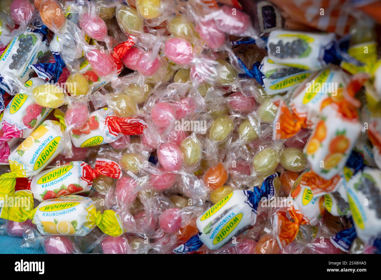 Munich, Germany. 23rd Feb, 2025. Hundreds of colorful sweets lie in a ...