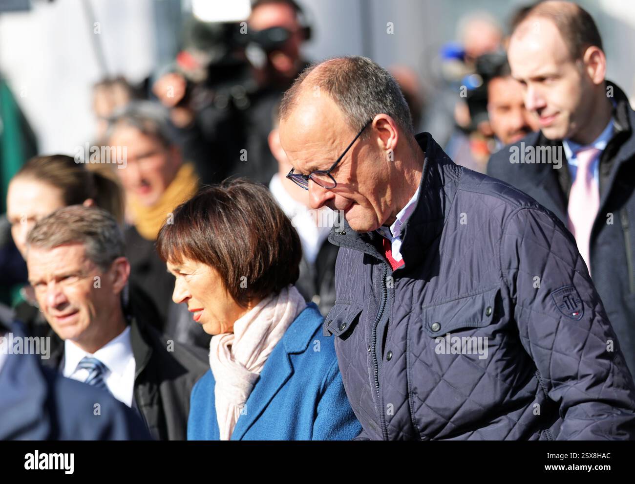 Arnsberg, Germany. 23rd Feb, 2025. Friedrich Merz (CDU, center r ...