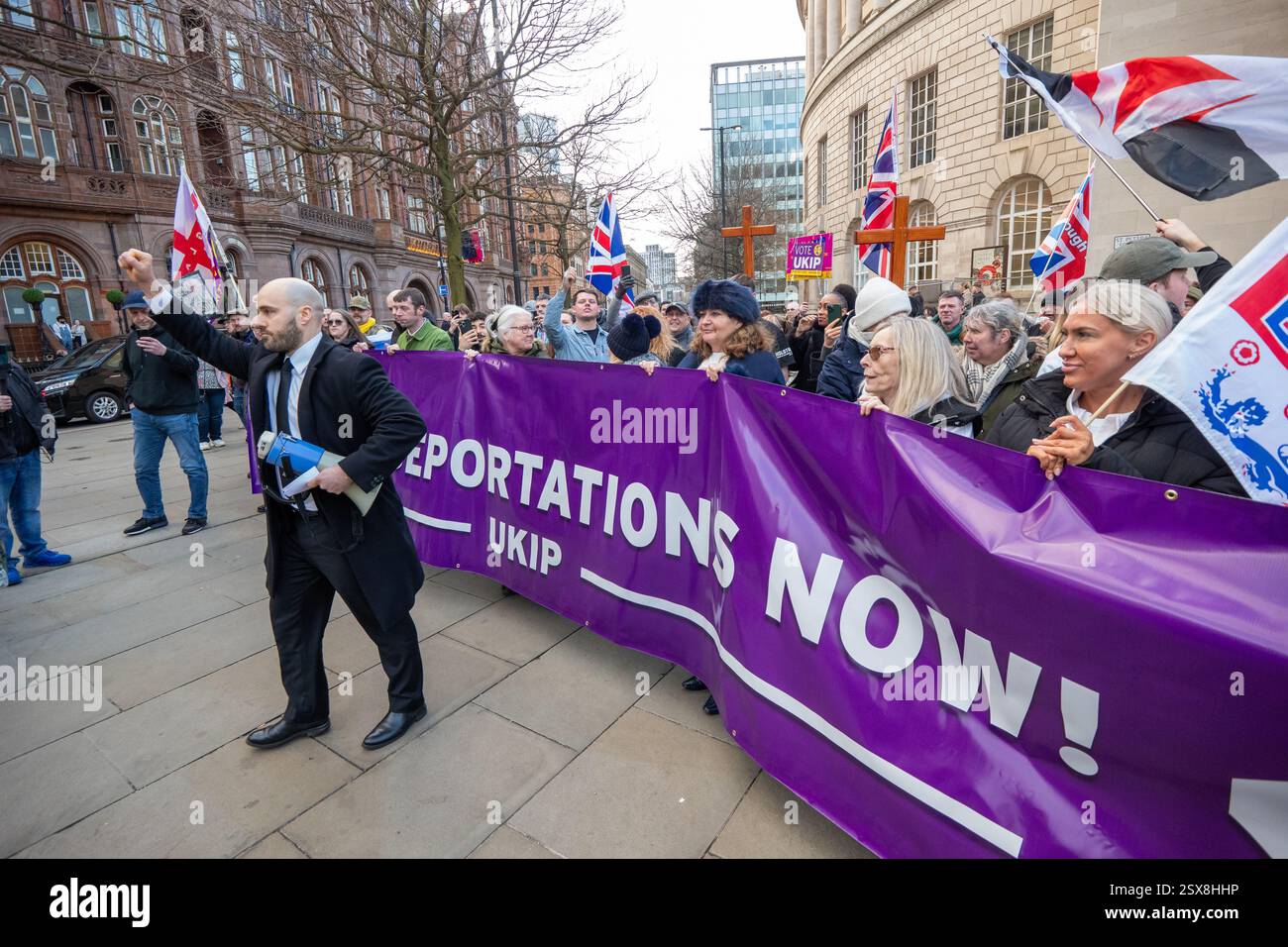 Manchester, UK. 22nd Feb 2025. Nick Tenconi gives a speech to supporters before marching with a ...