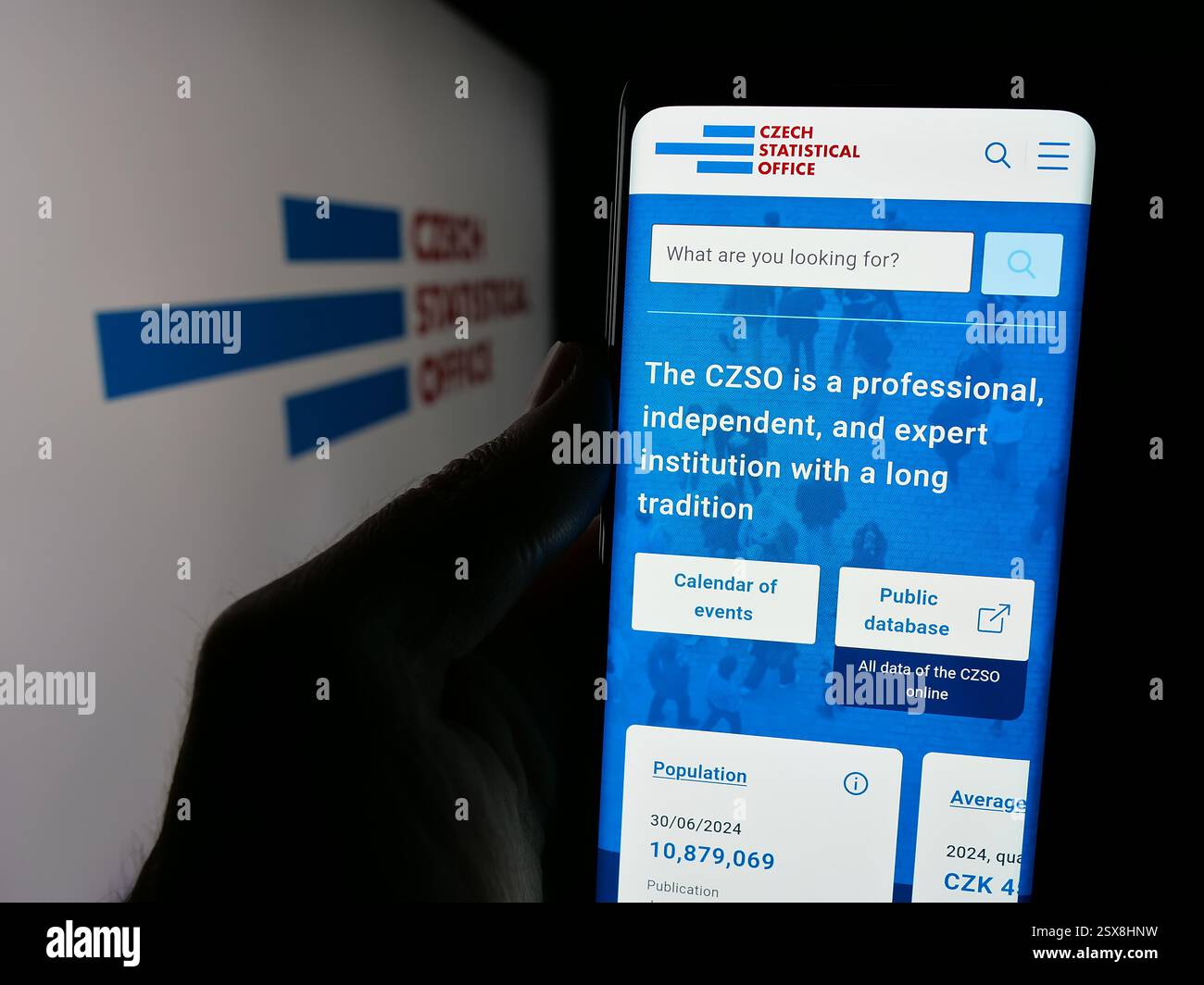 In this photo illustration, a person is holding a cellphone with the ...