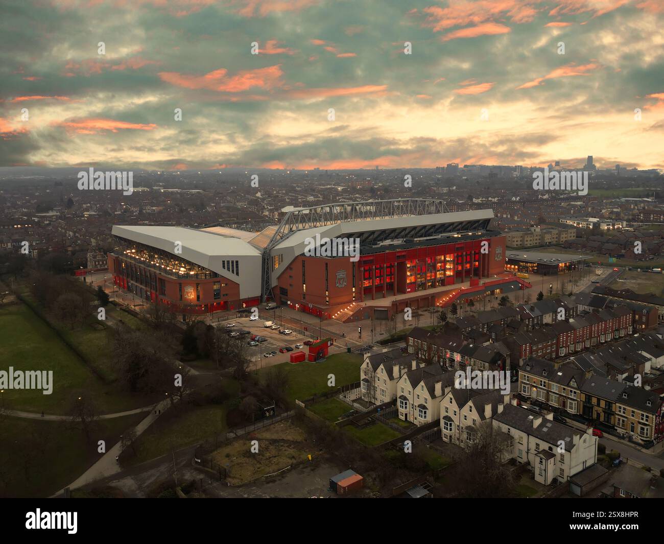 A breathtaking drone shot of Anfield at dusk, with stadium lights ...