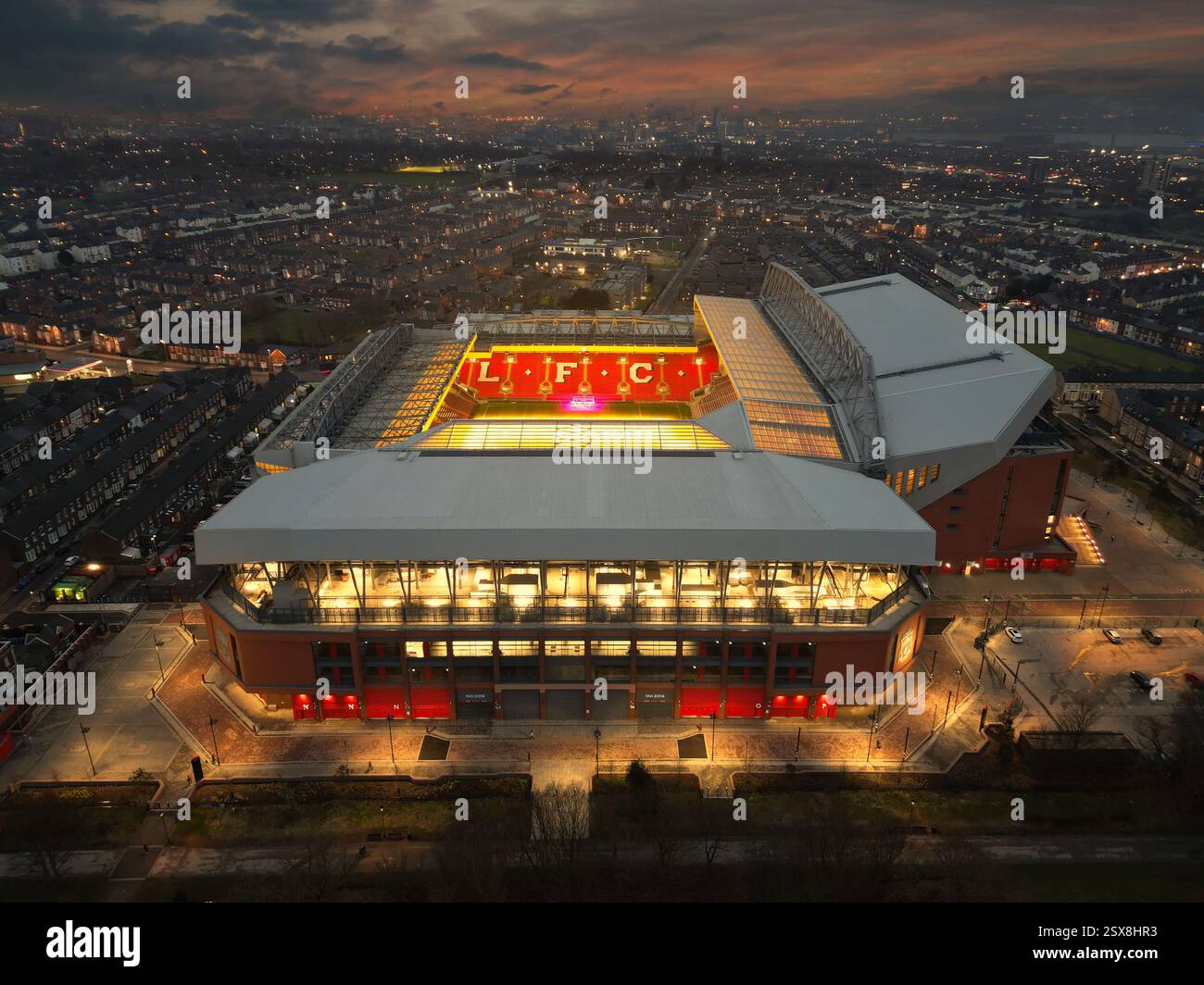 A breathtaking drone shot of Anfield at dusk, with stadium lights ...