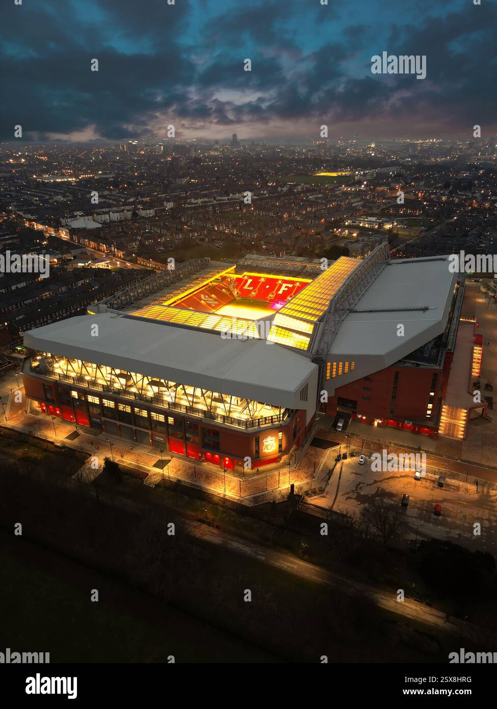 A breathtaking drone shot of Anfield at dusk, with stadium lights ...