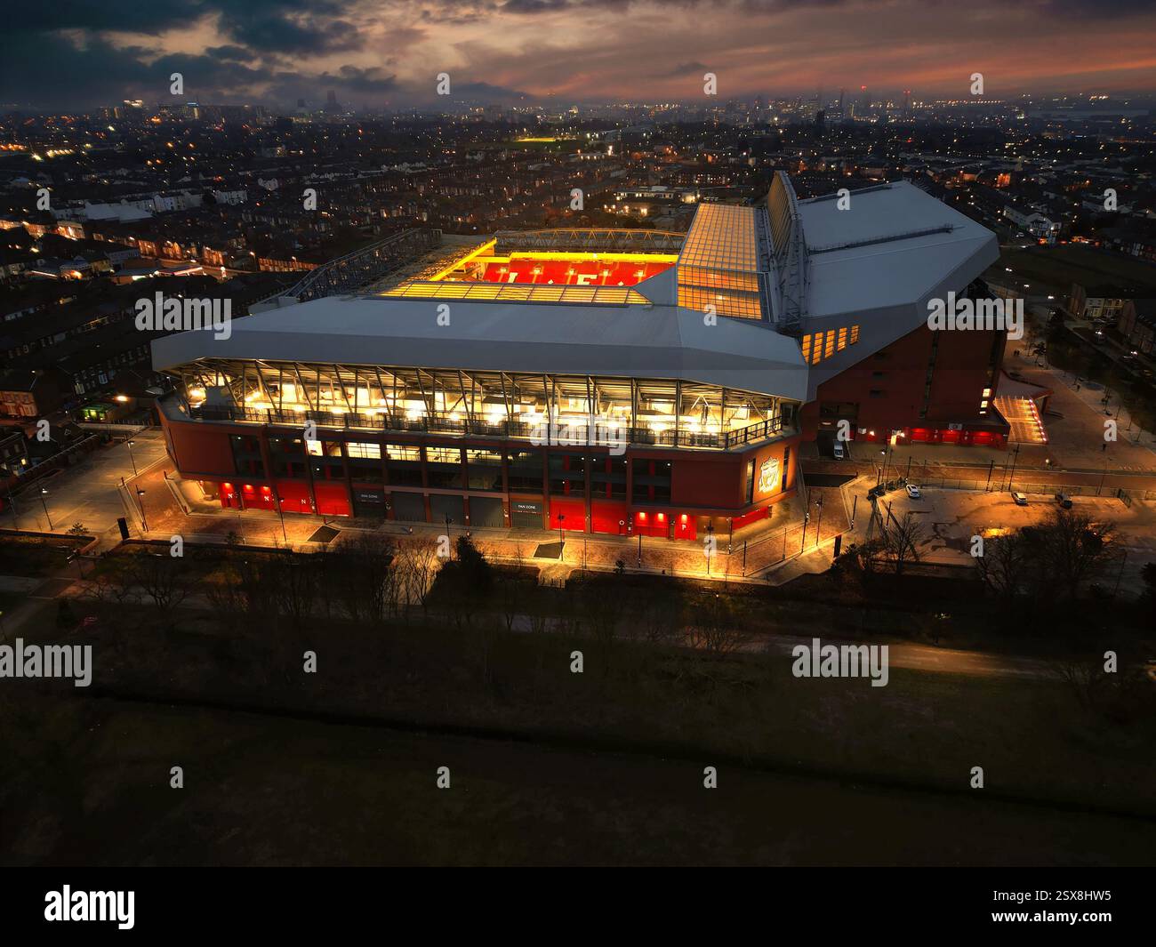 A breathtaking drone shot of Anfield at dusk, with stadium lights ...