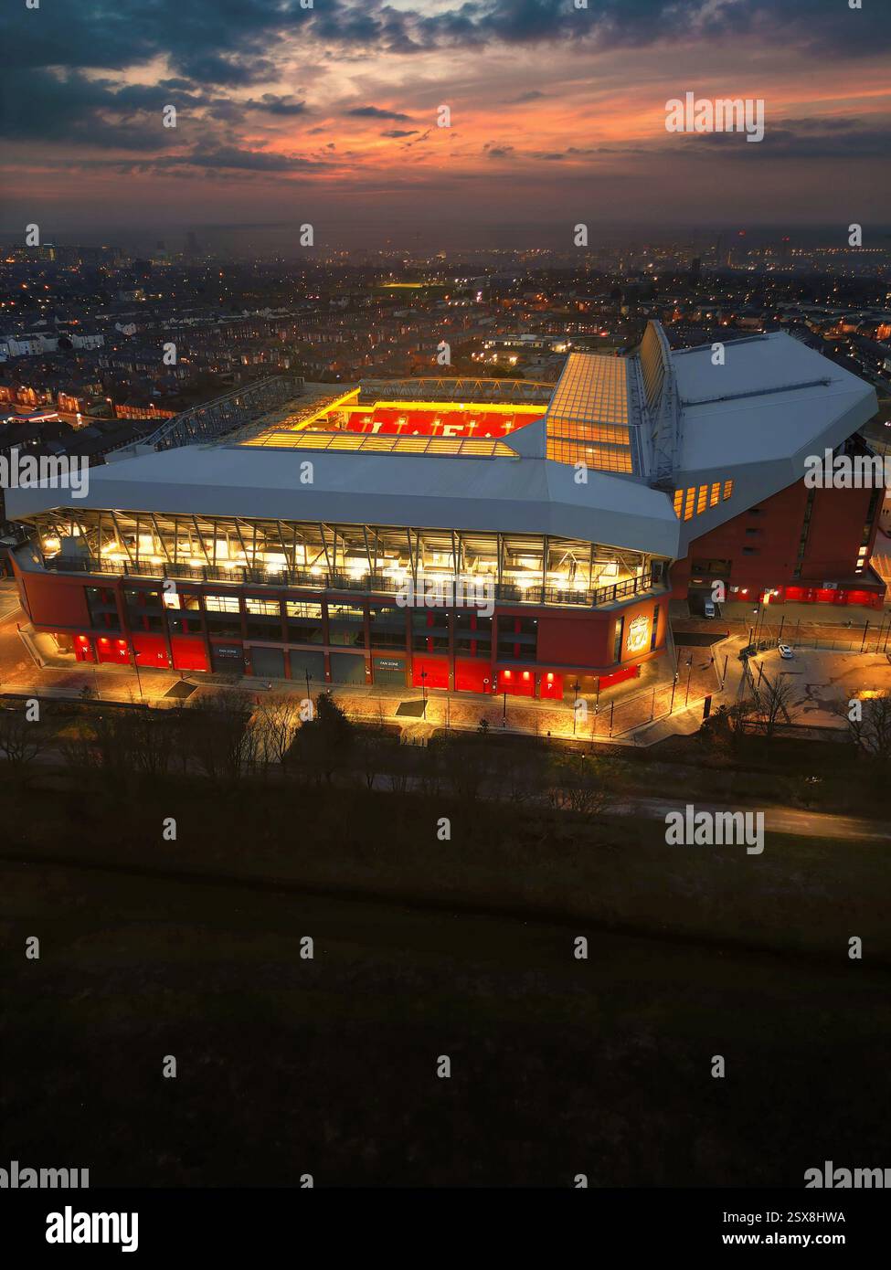 A breathtaking drone shot of Anfield at dusk, with stadium lights ...