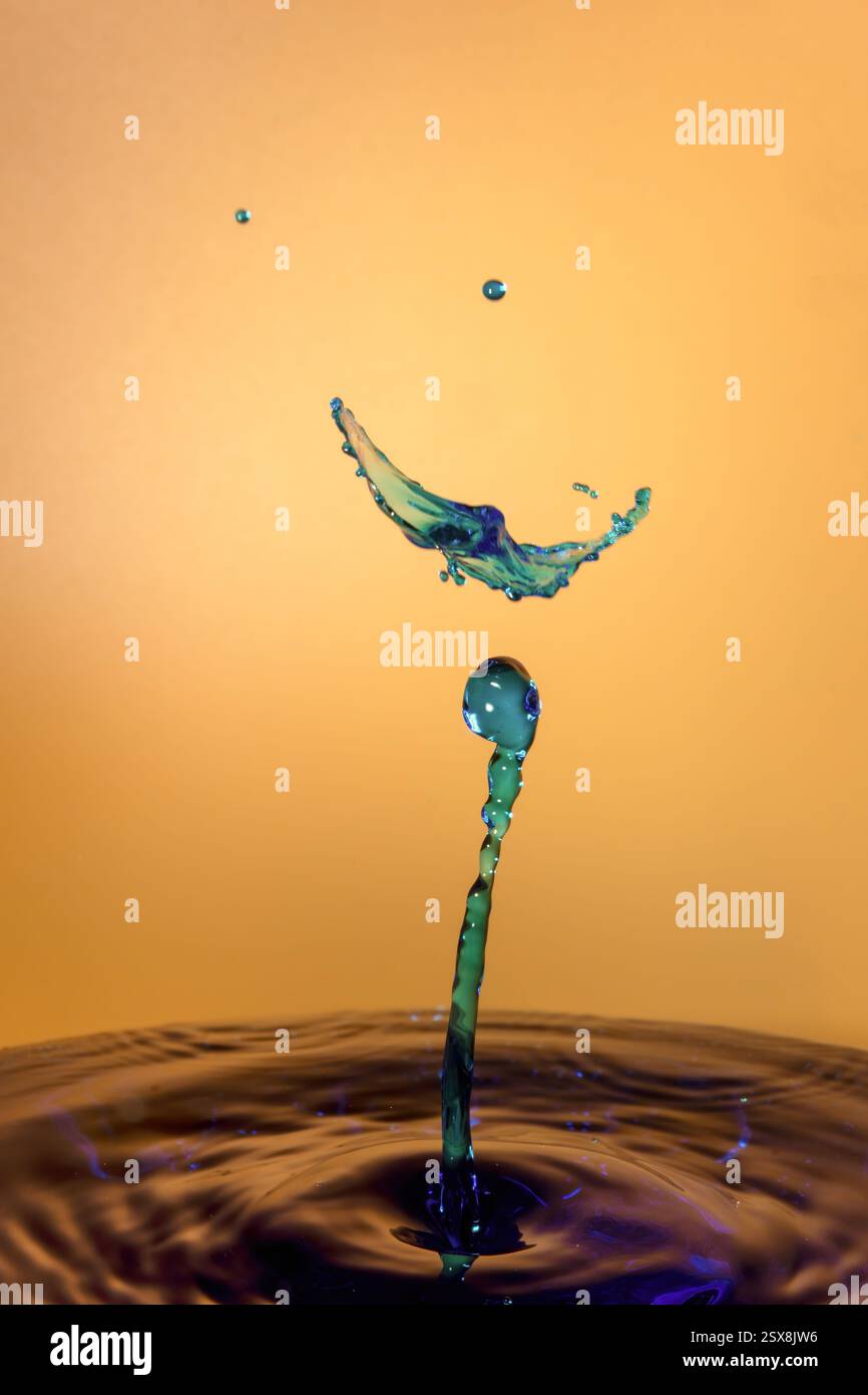 falling water drops with splash in macro Stock Photo - Alamy