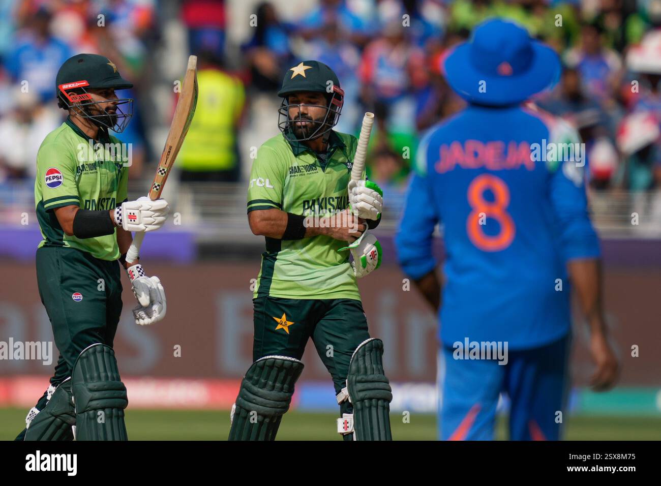 Pakistan's Saud Shakeel, left, celebrates his fifty runs during the ICC ...