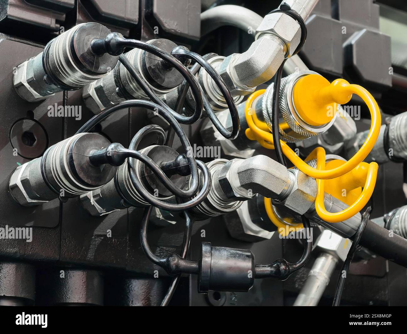 Hydraulic connectors and hoses create a complex interplay in industrial ...
