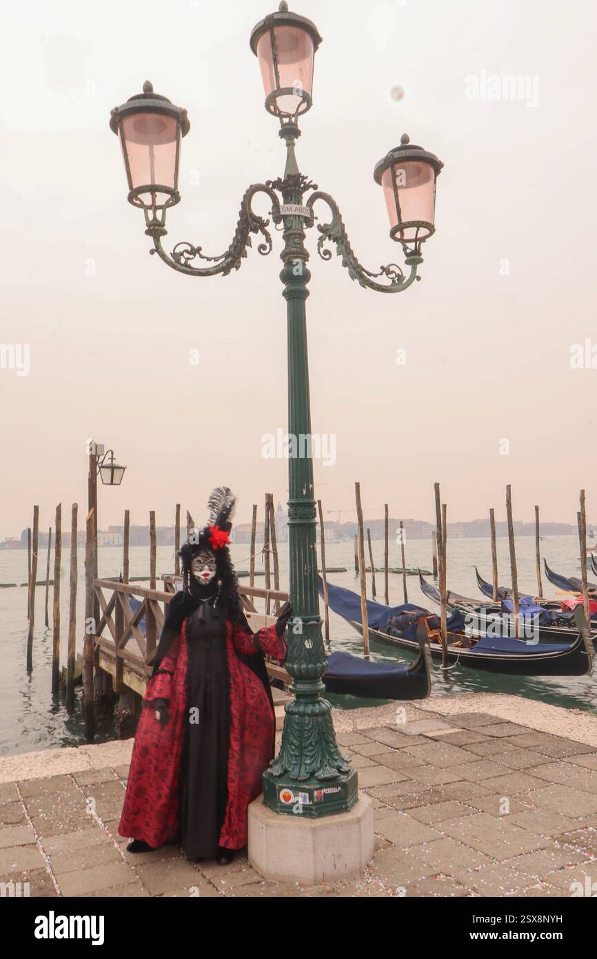 Venice, Italy. 23rd Feb, 2025. Carnival goers dressed in splendid ...