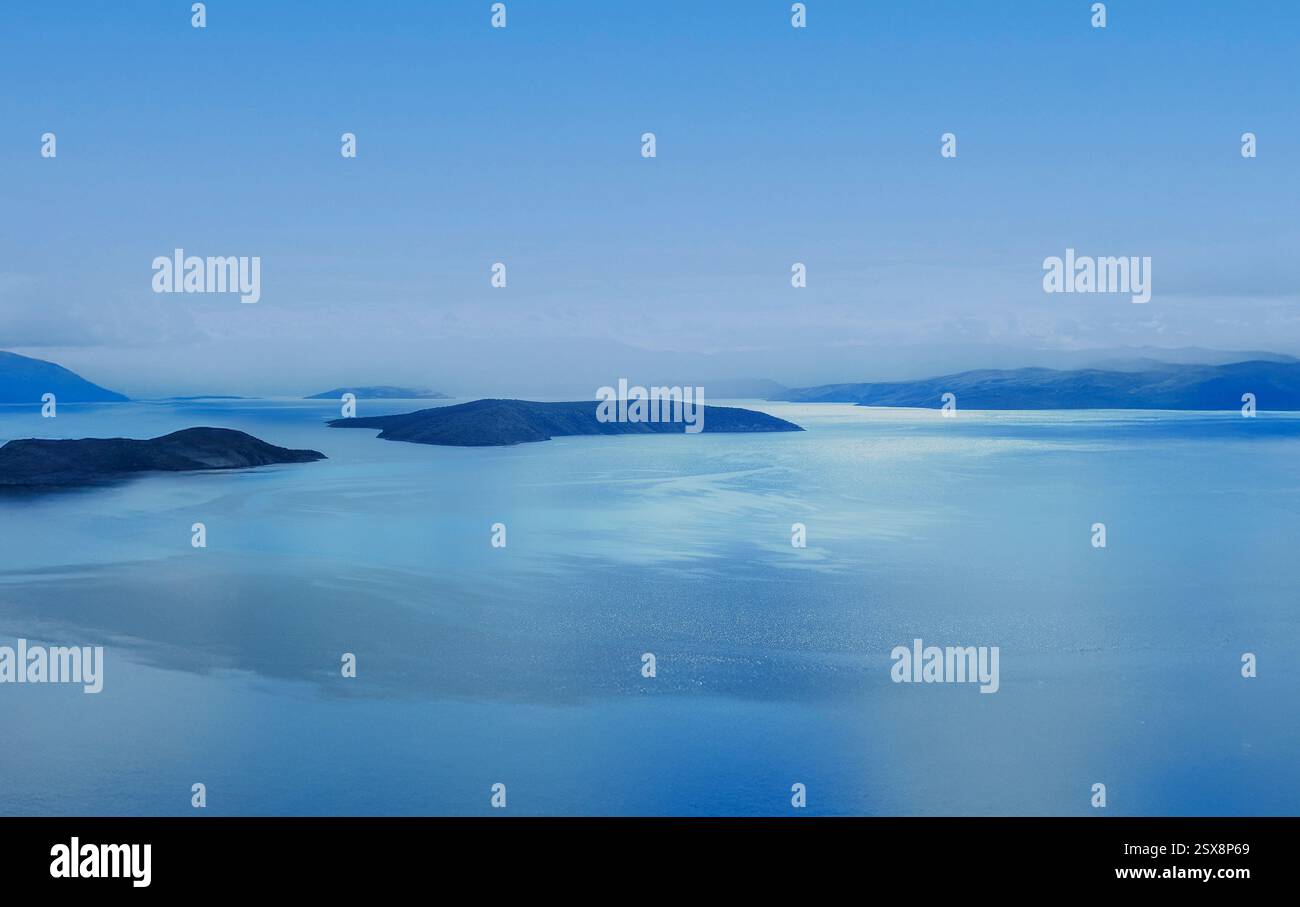 a beautiful summer landscape of islands in the middle of a blue sea ...