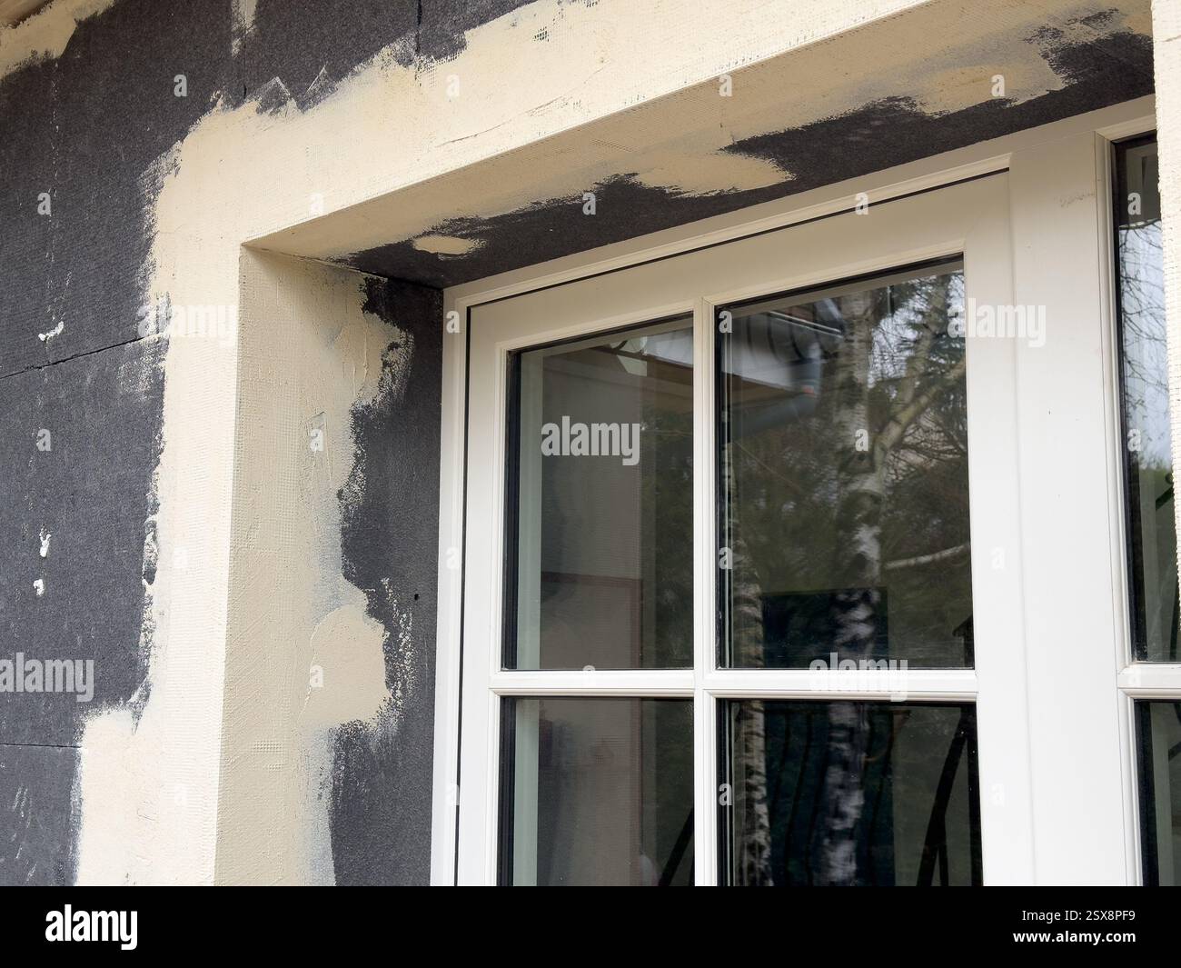 Renovation efforts showcase fresh window frame during home improvement ...