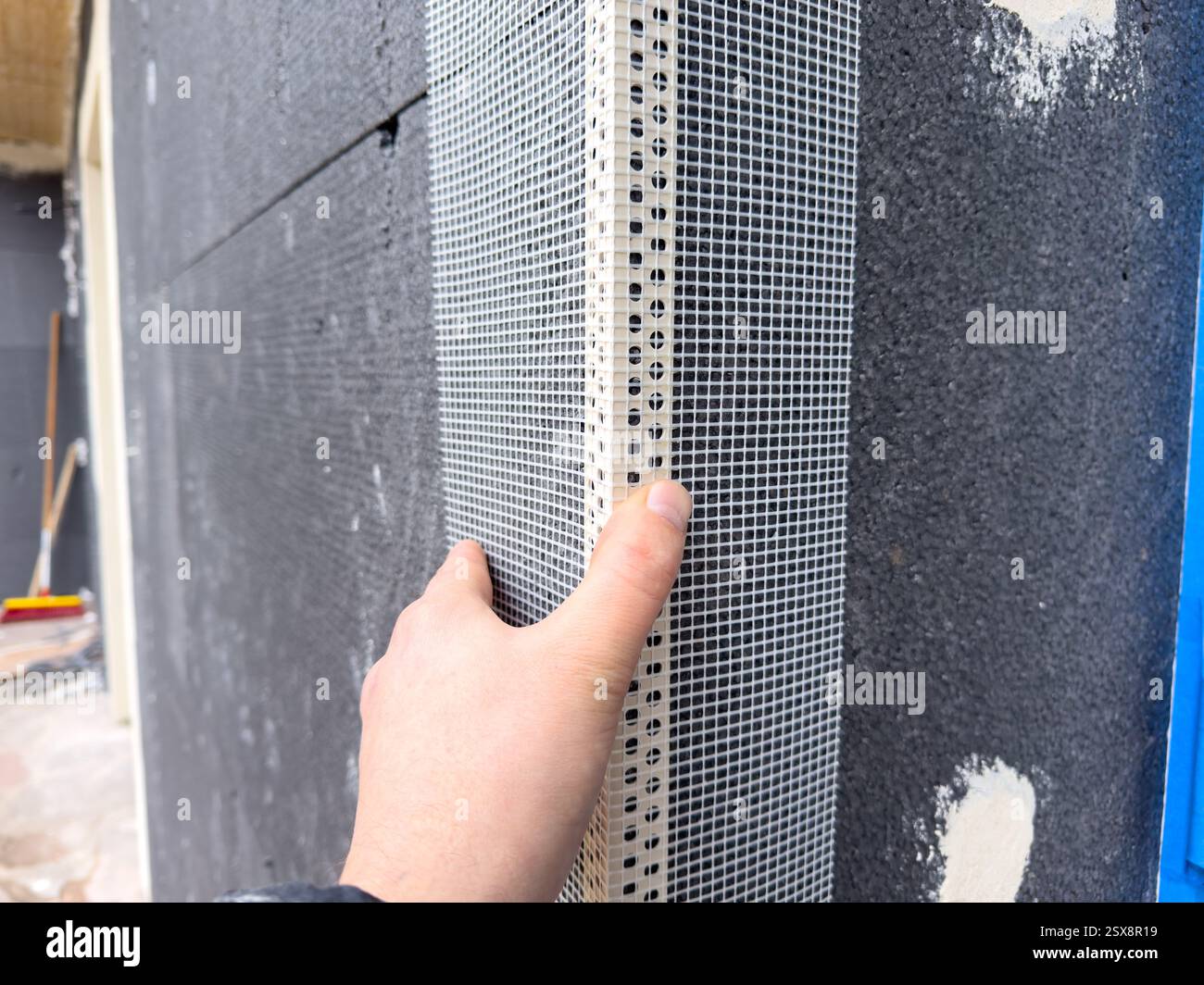 Creating a robust exterior finish with mesh on a building wall Stock ...