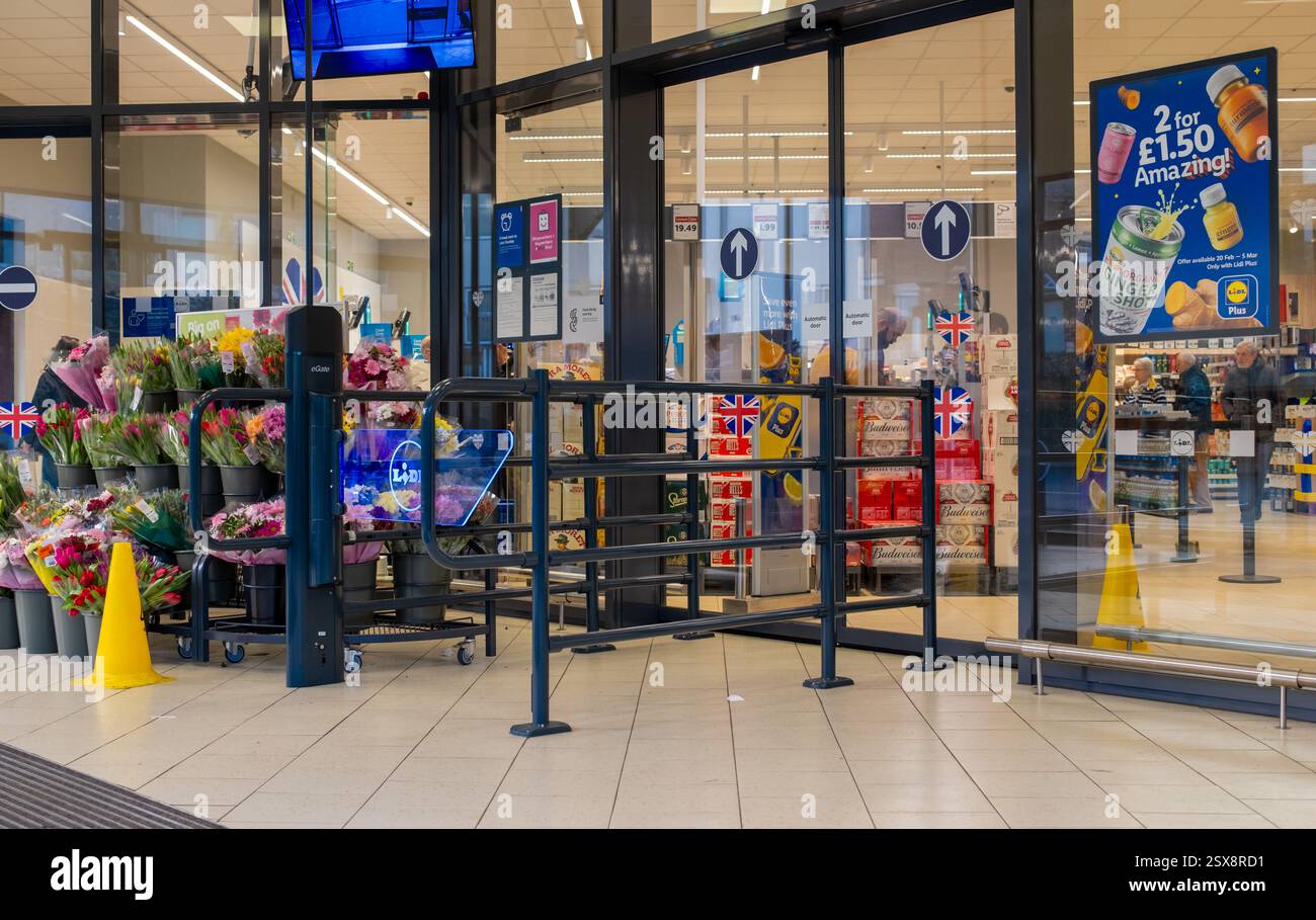 Lidl supermarket entrance lobby with flowers for sale and colourful ...