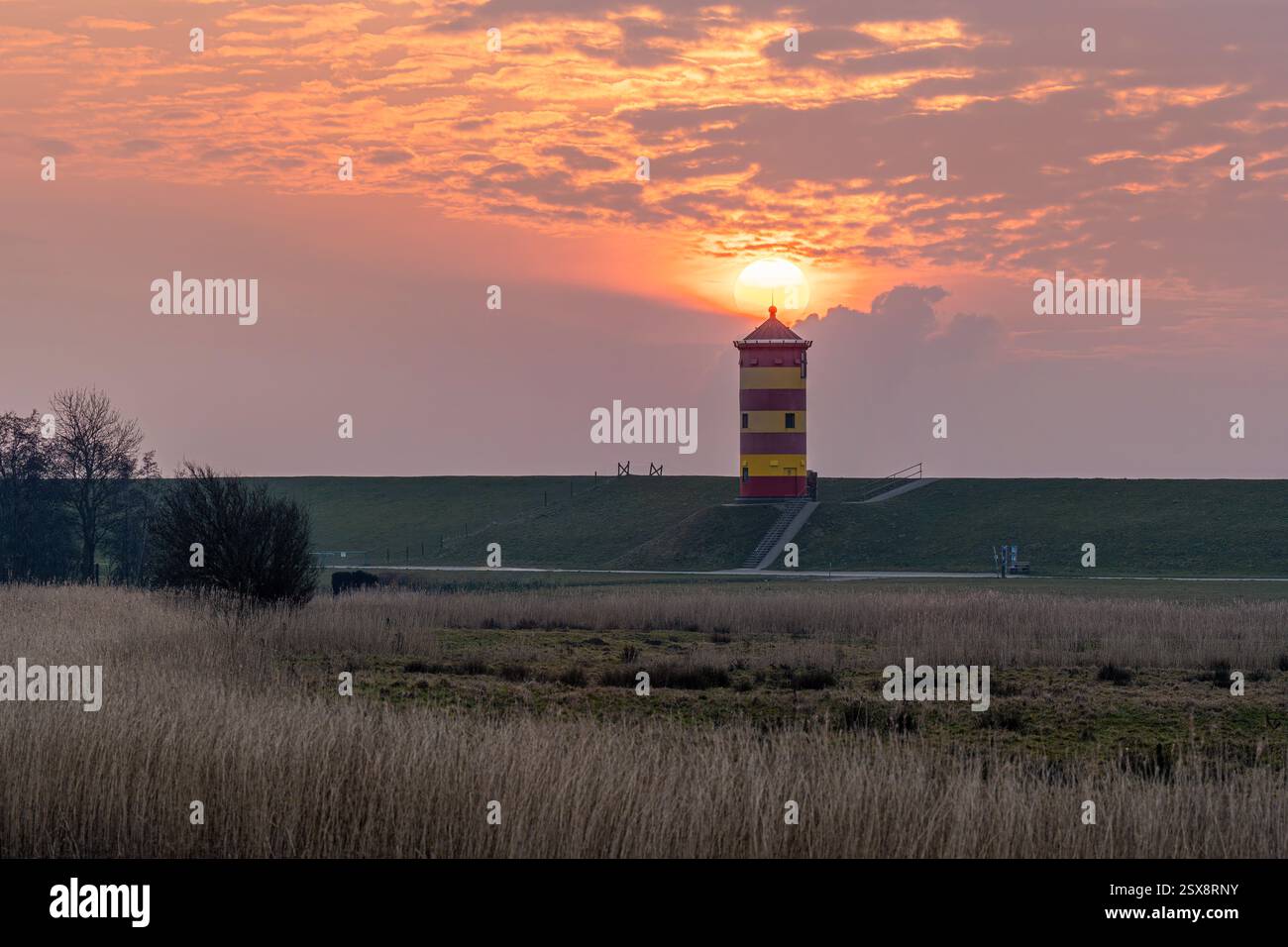 Pilsum, Germany - February 9, 2025: Lighthouse of Pilsum during sunset ...
