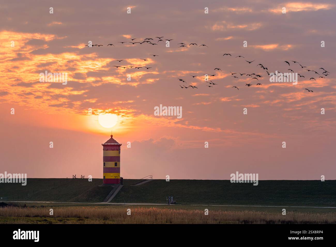 Pilsum, Germany - February 9, 2025: Lighthouse of Pilsum during sunset ...